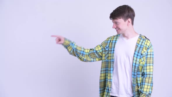 Happy Young Handsome Man Touching Something, Stock Footage | VideoHive