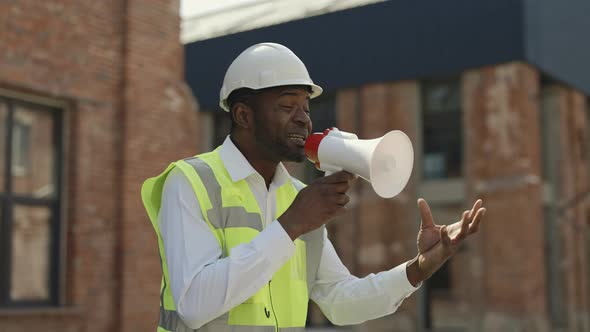 Expressive Foreman Shouting Into Bullhorn Outdoors, Stock Footage ...