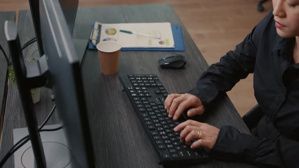 Focus on Programer Hands Typing Code on Keyboard While Looking at Computer Screen, Stock Footage