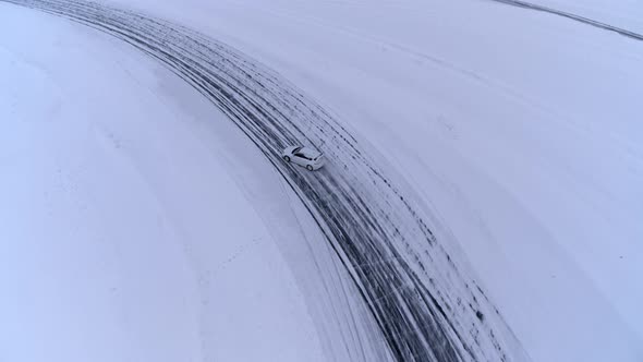 Aerial view of the rally car on a snowy road, Stock Footage | VideoHive