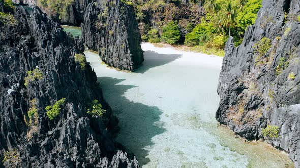 Aerial Drone View Over Clear Shallow Lagoon Water Surrounded By Sharp ...