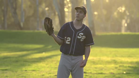 A young man playing catch with a baseball., Stock Footage | VideoHive