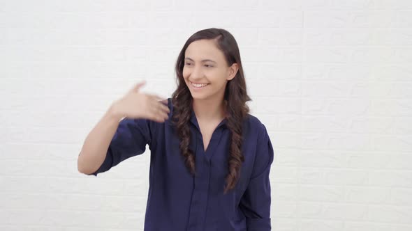 Indian girl pointing and calling, Stock Footage | VideoHive