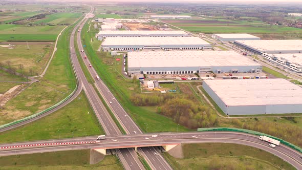 Aerial Shot of Industrial Warehouse Storage Building Loading Area where ...