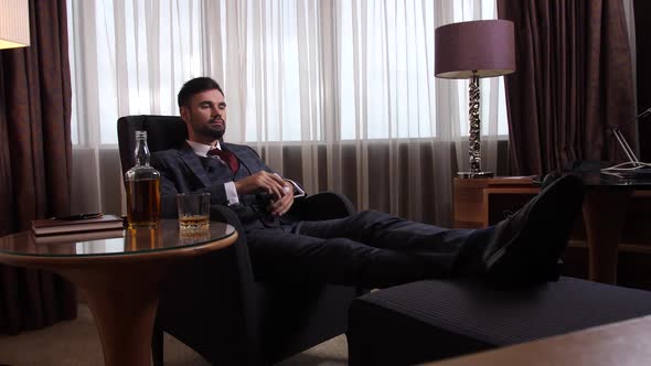 Rich Man Counting Money and Drinking Alcohol, Stock Footage | VideoHive