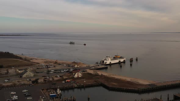 an aerial shot of the Orient Point ferry as it takes on vehicles and ...