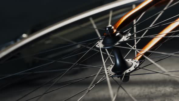 Retro bicycle lying on concrete road. Spinning wheel. Endless looping ...