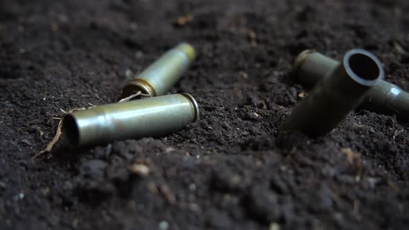 Bullet casings fall to the ground. Slow motion., Stock Footage | VideoHive