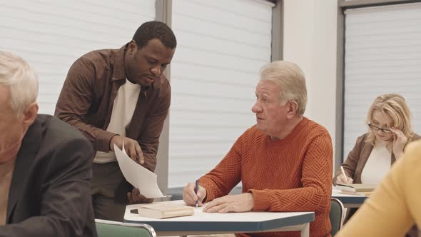 Teacher Explaining Material to Senior Man in Class, Stock Footage ...
