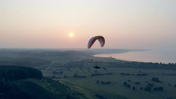 Parasailing Vehicle Is Flying High Above the Ground, Stock Footage
