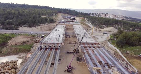 Aerial footage of a large scale highway construction project with ...