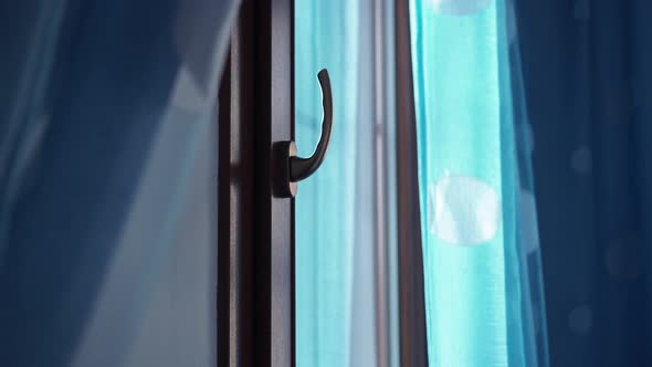 Plastic Window Turns the Handle and Opens Partially Upwards, Stock Footage