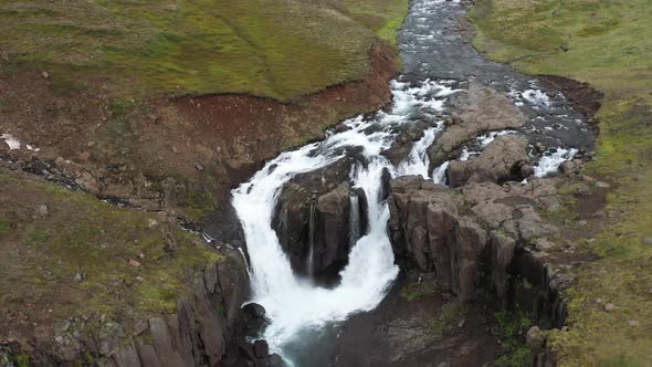 Split waterfalls in Iceland with drone video pulling out., Stock Footage