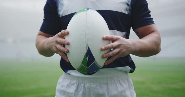Male rugby player holding rugby ball in the stadium, Stock Footage