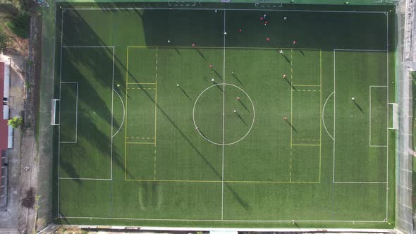 Two teams playing football top view. Children are playing football ...