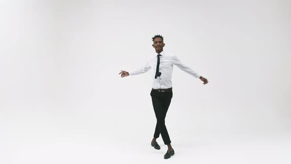 Black Serious Man in an Office Suit Dancing Breakdancing in the Studio ...