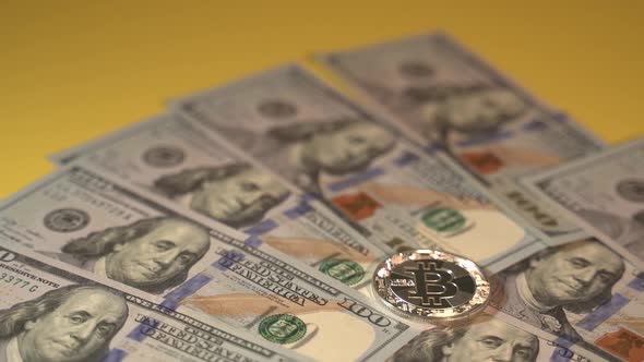 Bitcoin BTC Coin Coin on Bills of 100 Dollars, Stock Footage | VideoHive