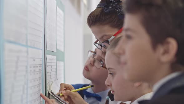 Children Looking at Timetable on First Day at School, Stock Footage