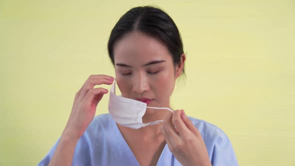 Young Asian Woman Take Off Face Mask Removing From Face, Stock Footage