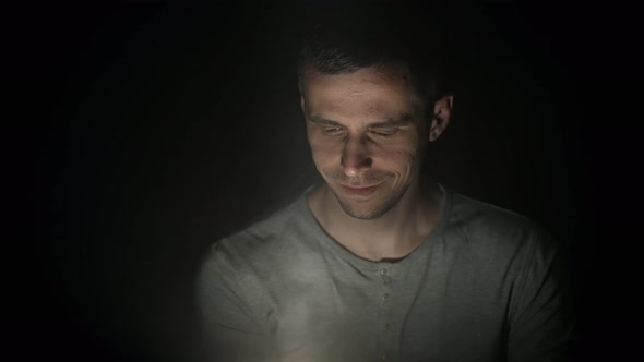 Man Looking at Something Glowing, Stock Footage | VideoHive