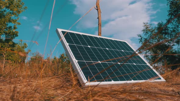 Portable Solar Panel Against Sky and Clouds Lying on the Ground Used in ...