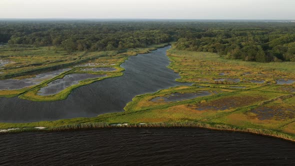 descending crane shot over the waters at East Islip Marina & Park ...