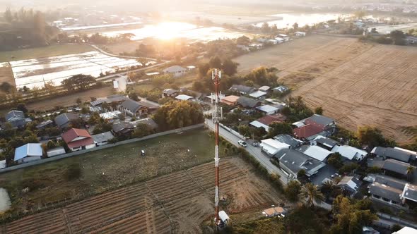 Aerial view shot around of telecommunication tower in a rural location, Stock Footage