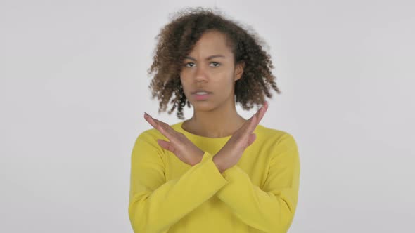 Young African Woman Showing No Sign By Arm Gesture on White Background ...