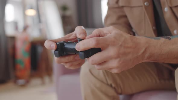 Hands of Man Using Controller and Playing Console Game, Stock Footage