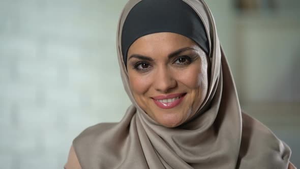 Pretty Muslim Housewife in Her 30s Looking at Camera, Female Wellness ...