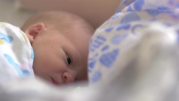 Newborn baby having hiccups and possetting after feeding, Stock Footage