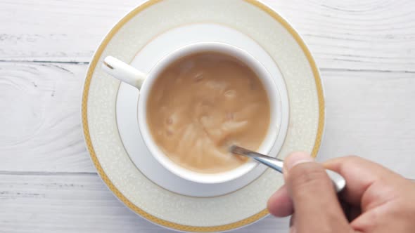 Person Hand Stirring Tea with Spoon, Stock Footage | VideoHive
