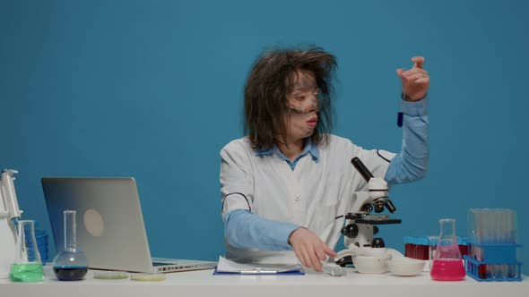 Insane Goofy Scientist Using Micro Pipette and Test Tube, Stock Footage
