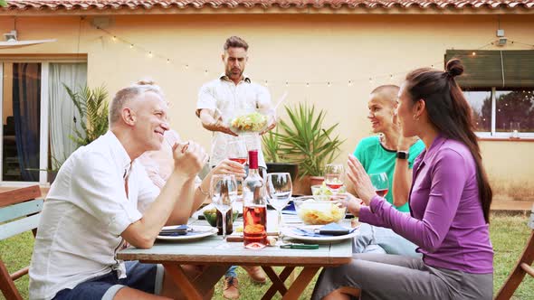 Friends Celebrating Dinner Party Together Sharing Homemade Meal Wirth ...