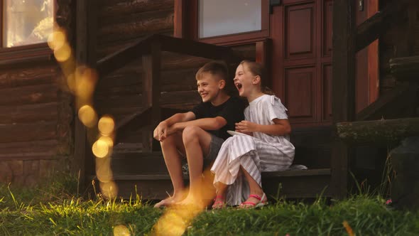 Kids with Pancakes Talking Outside House by FrameStock | VideoHive