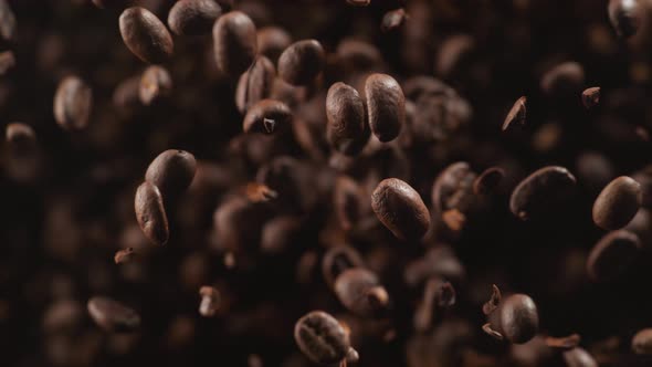 Coffee beans fly after being exploded. Slow Motion., Stock Footage