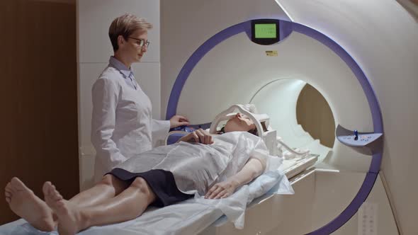 Radiologist Moving Patient into MRI Machine, Stock Footage | VideoHive