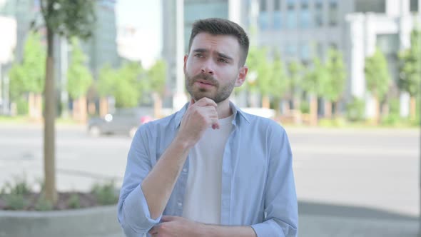 Outdoor Portrait of Pensive Young Man Thinking, Stock Footage | VideoHive