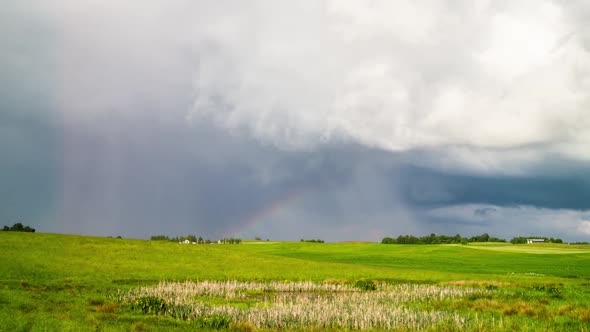 Rural landscape, rain clouds and rainbow, Stock Footage | VideoHive
