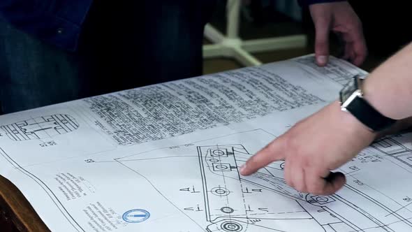 Man looking the blueprints, Stock Footage | VideoHive