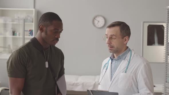 Portrait of Soldier with Broken Arm and Doctor in His Office, Stock Footage