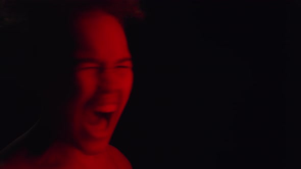 Emotional Woman Screaming in Red Lighting, Stock Footage | VideoHive
