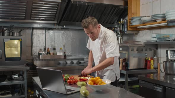 Chef Cooking While Watching Video Recipe, Stock Footage | VideoHive