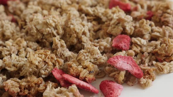 Strawberry flavor muesli on pile close-up 4K 2160p 30fps UltraHD ...