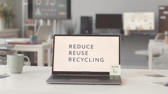 Slide with Reduce Reuse Recycling on Laptop at Office Desk, Stock Footage