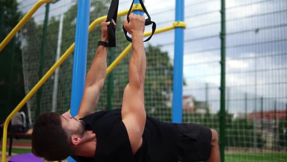 Muscular Sportsman Doing Hanging Pull Ups Exercise Using Fit Belt to ...