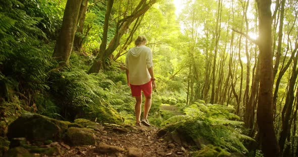 Tourist Walks on the Edge of Steep Hill By the Cliff, Stock Footage