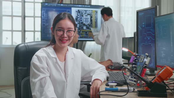 Modern Electronics Development Facility: Asian Woman Smiling Charmingly ...