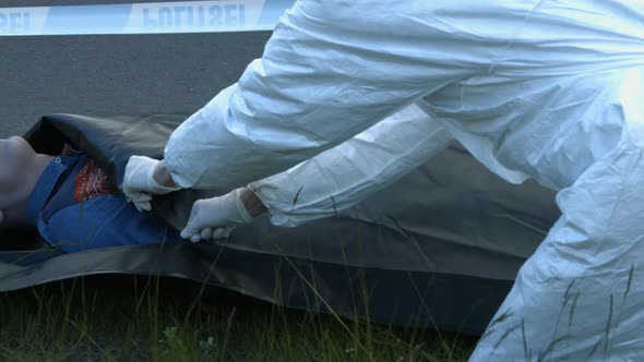 Coroner Zip Dead Man into Body Bag, Stock Footage | VideoHive