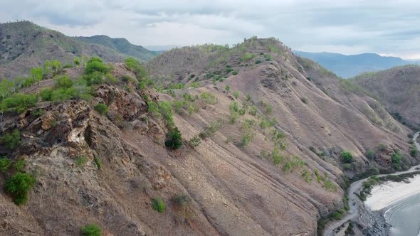 A scattering of green trees on the hill and mountain landscape during ...